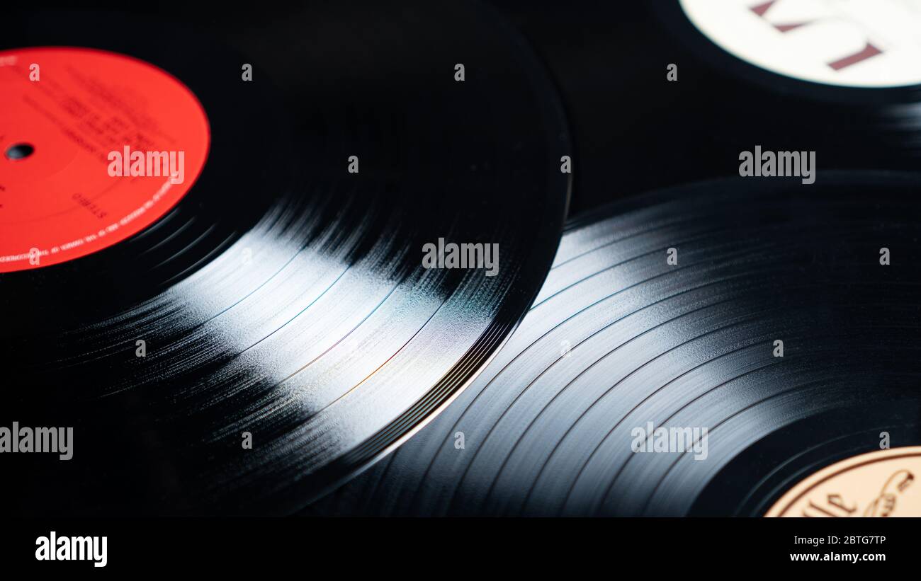 Top view of very close up scattered vinyl disks background in hard ...