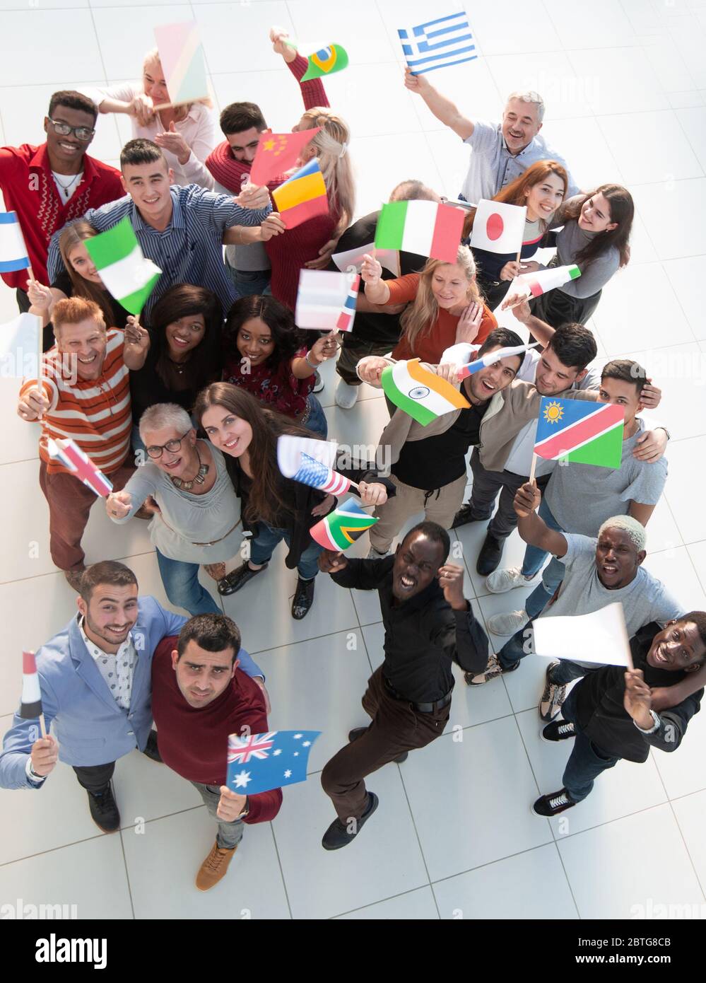 Top view international friends standing together with flags Stock Photo ...