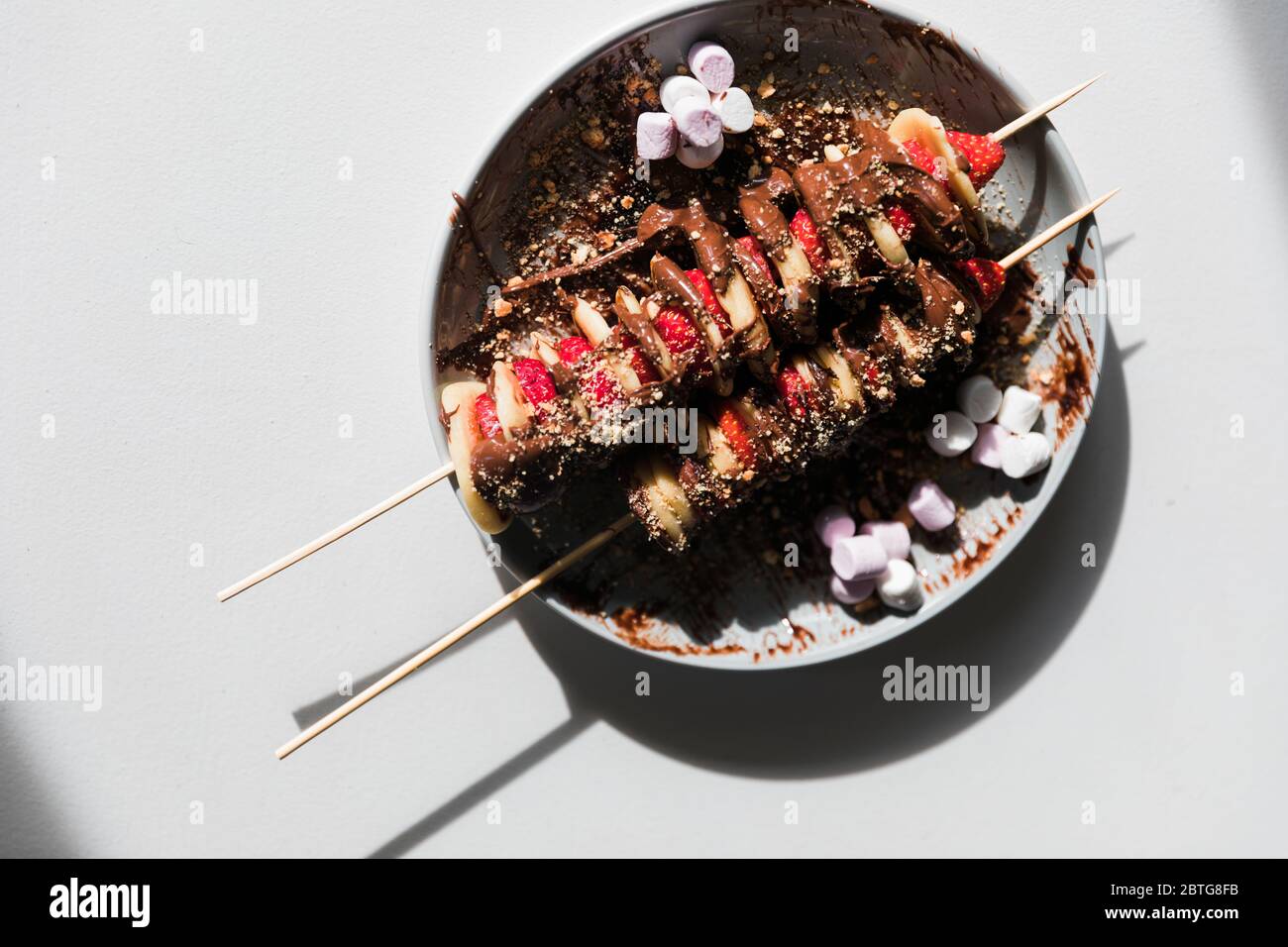 Homemade mini crepe and strawberry skewers Stock Photo - Alamy