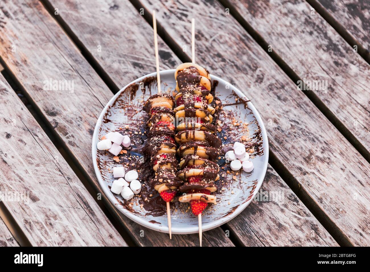 Homemade mini crepe and strawberry skewers Stock Photo - Alamy