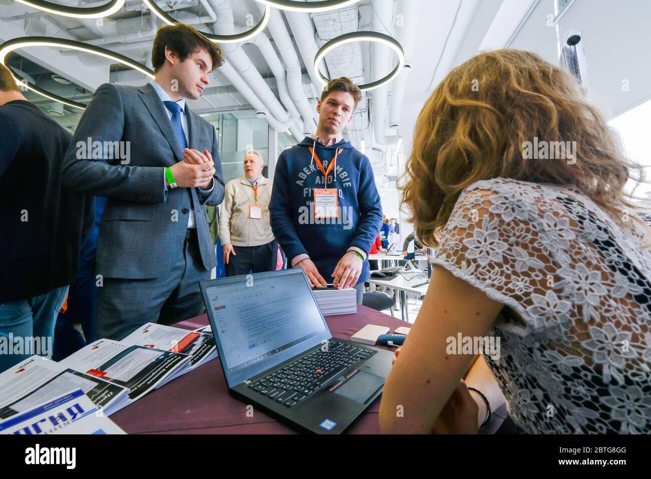 Conference visitors converse at hall Stock Photo - Alamy