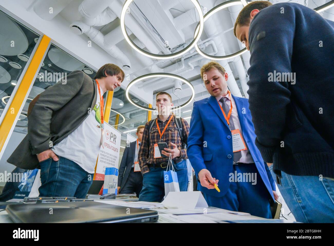 Conference visitors converse at hall Stock Photo - Alamy