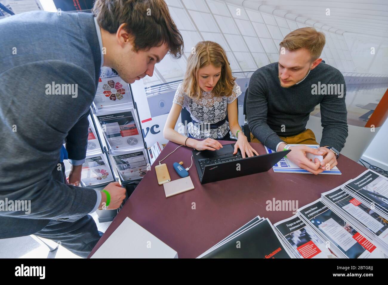 Conference visitors converse at hall Stock Photo - Alamy