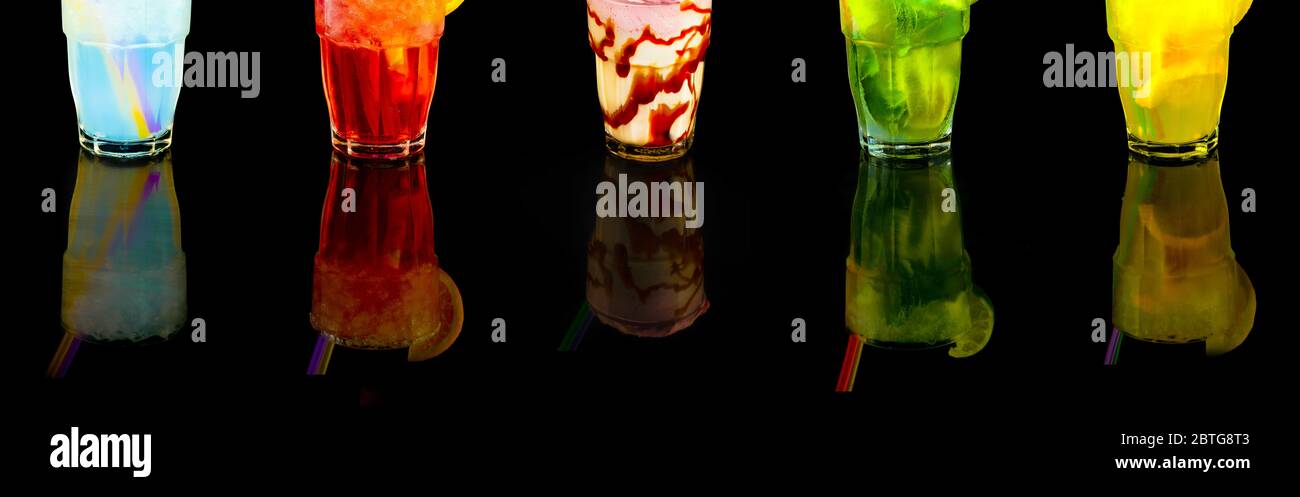 refreshing summer cocktails with reflection over black background ...