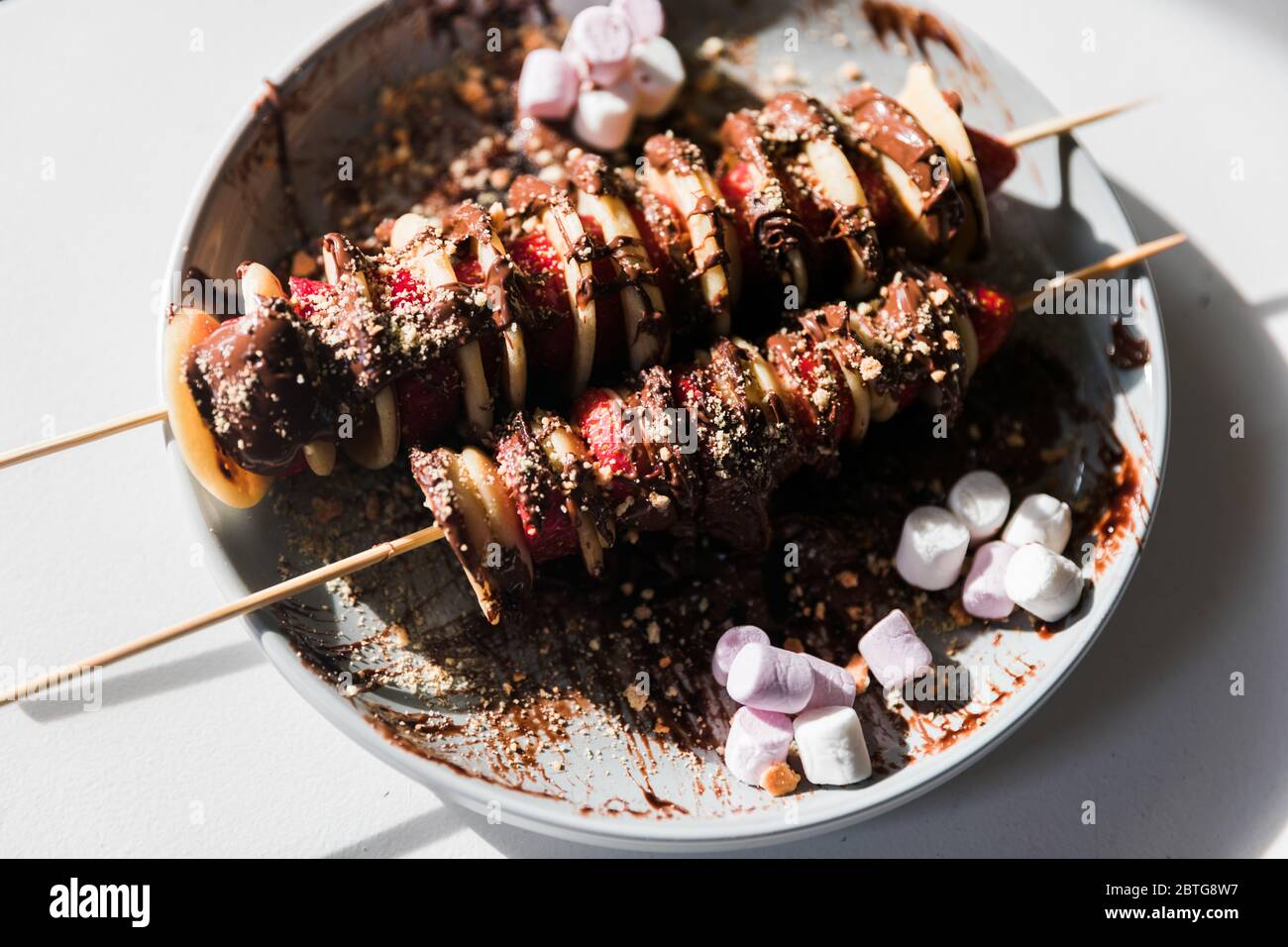Homemade mini crepe and strawberry skewers Stock Photo - Alamy