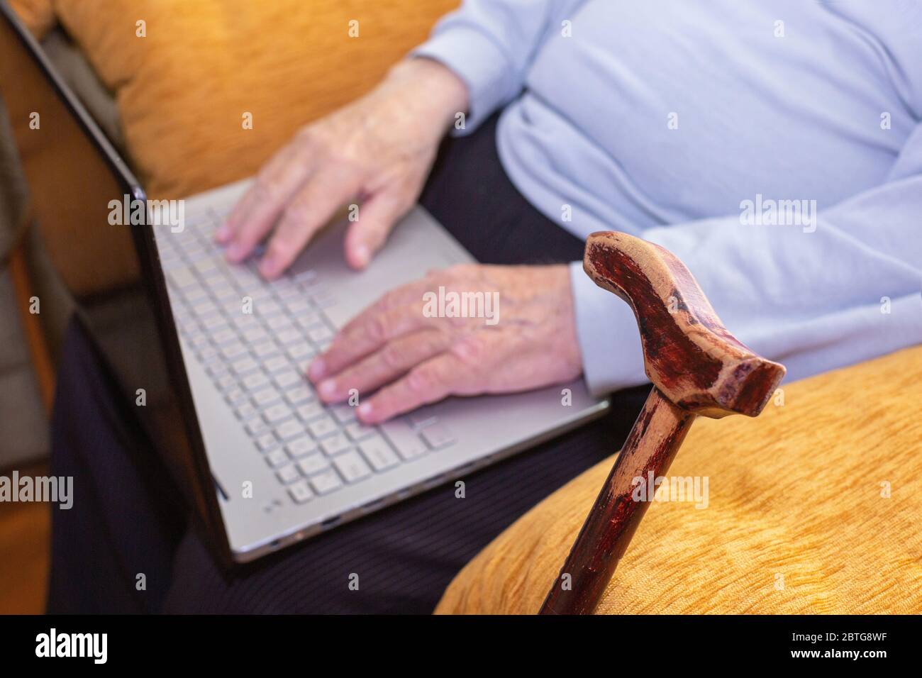 Senior disabled man's hands typing on the computer. focus on walking ...