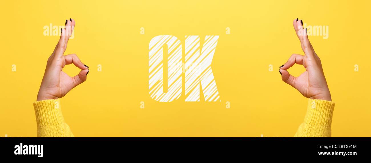 hand ok sign over trendy yellow background, panoramic image Stock Photo ...