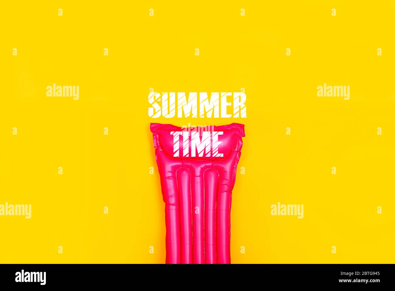 pink swim mattress on a yellow background, concept of summer vacation ...