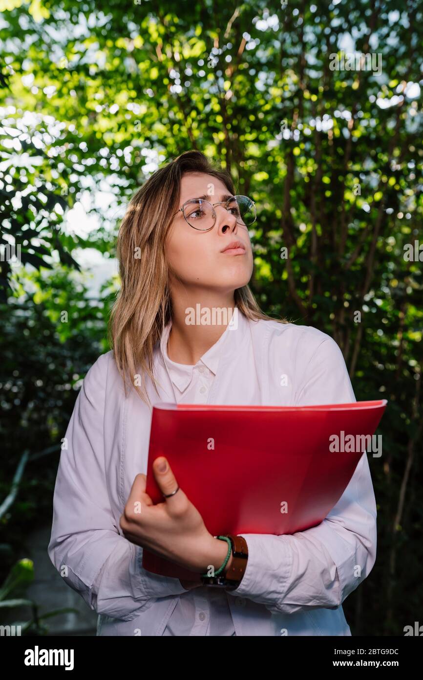 Young female agricultural engineer working in greenhouse Stock Photo ...