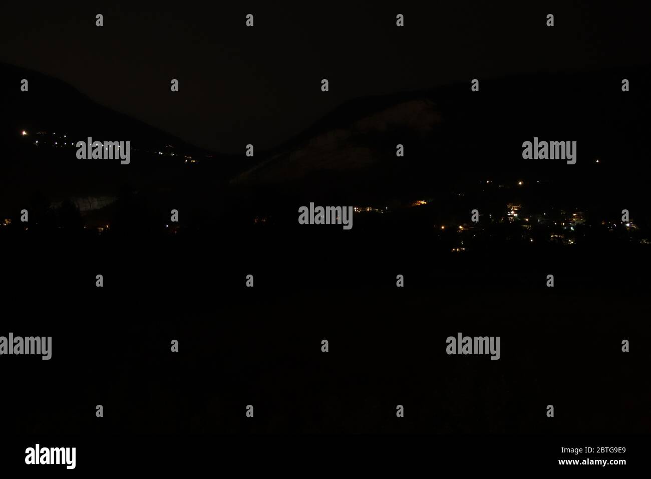 night landscape with street lights and mountains Stock Photo - Alamy