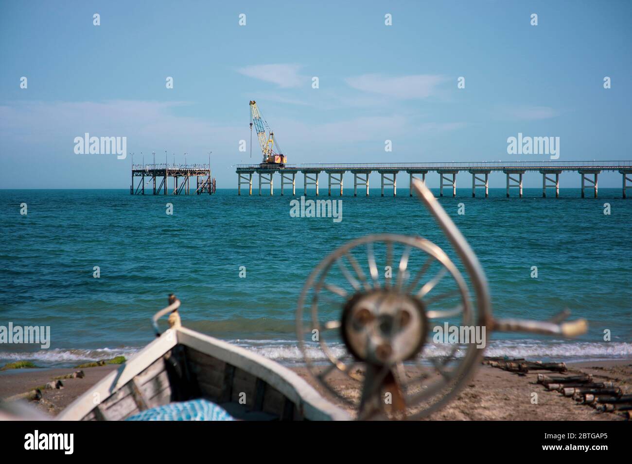 Boat with mussels and oyster container with a fishing pier Stock Photo ...