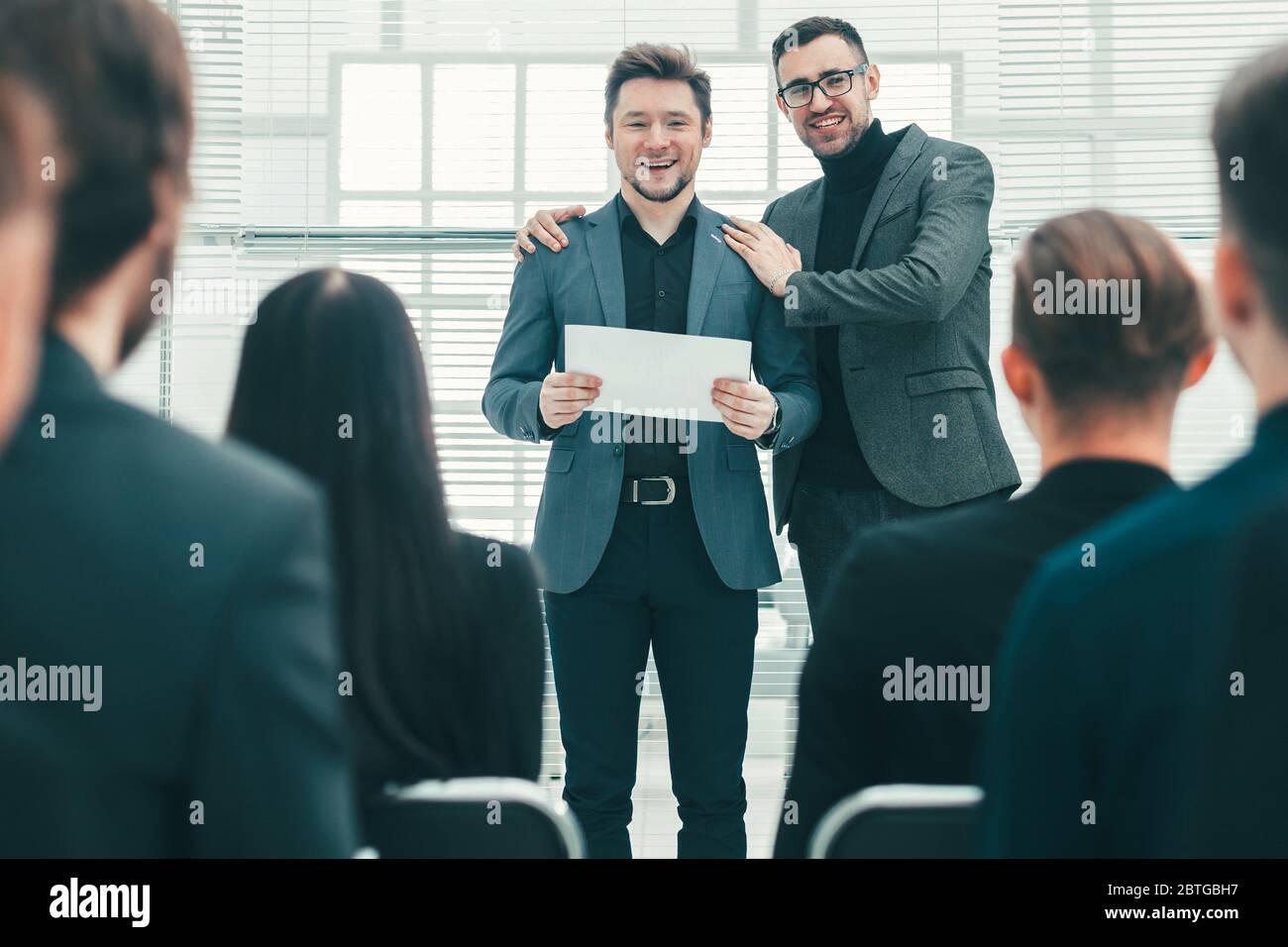 project Manager awarding the best employee. teamwork Stock Photo - Alamy
