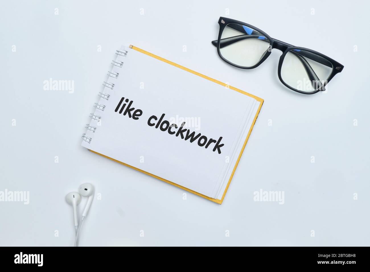 Like clockwork - english idiom hand lettering on wooden blocks Stock ...