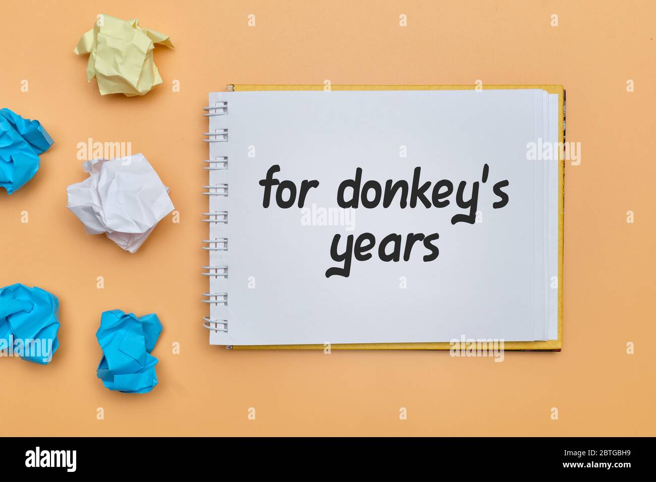 For donkey years - english idiom hand lettering on wooden blocks Stock ...