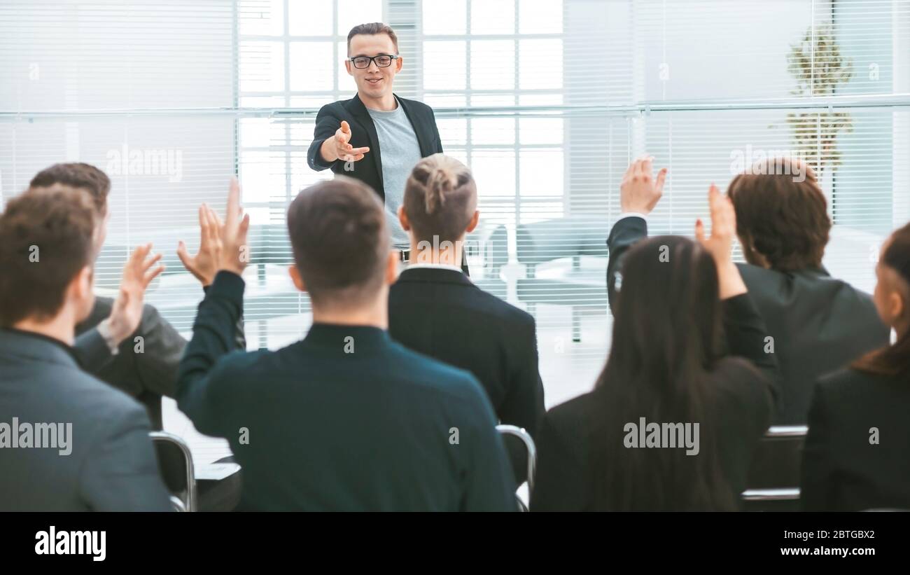 speaker by asking questions during the seminar Stock Photo - Alamy