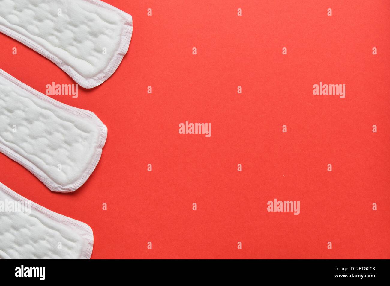 Pad on a red background with a top view Stock Photo - Alamy