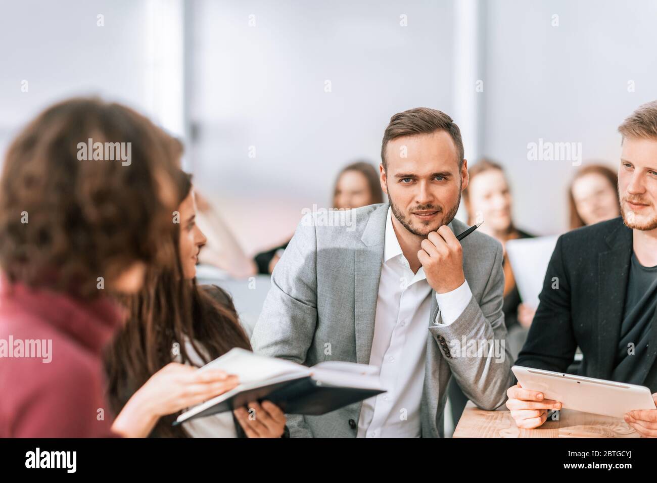 close up. brooding entrepreneur sitting at office Desk Stock Photo - Alamy