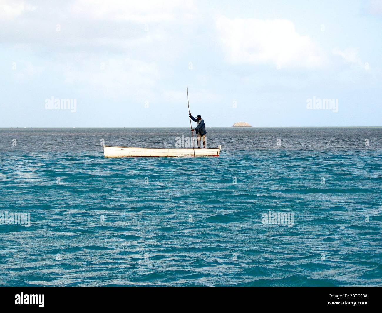 Small fishing boat returning with the catch of the day Stock Photo - Alamy