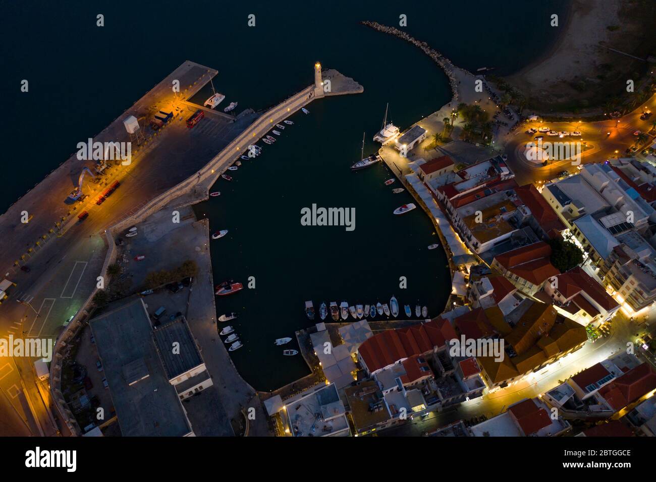 Aerial view of Rethymno city in Crete illuminated late in the afternoon ...