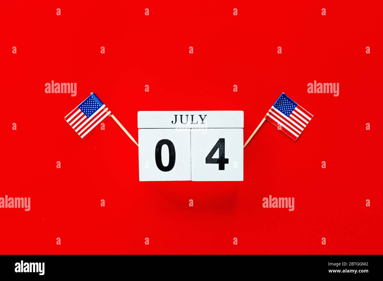 July 4th. Mockup of july 4 wooden color calendar on red background ...