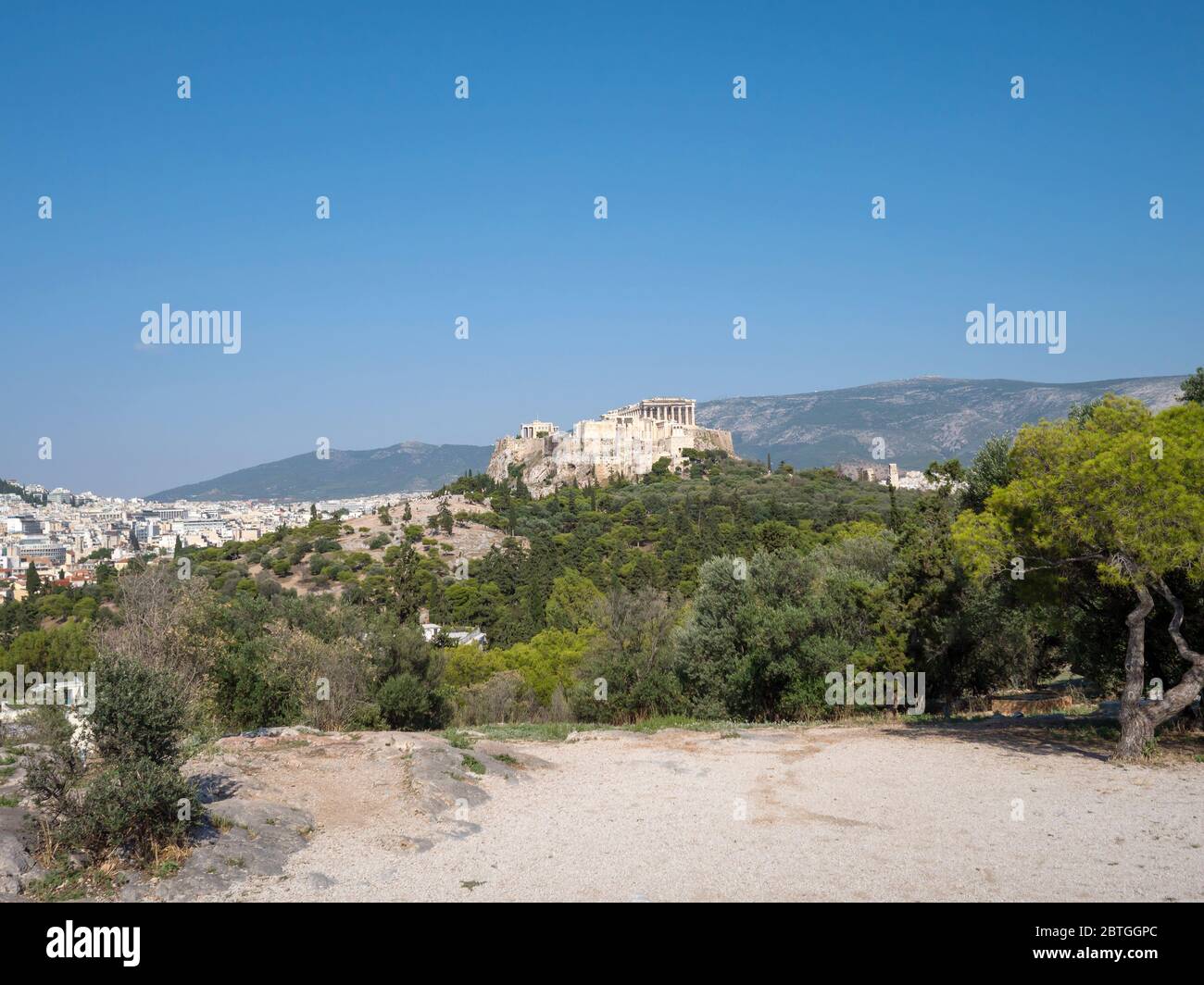 The view of Parthenon temple and the Acropolis hill from Pnyx in Athens ...