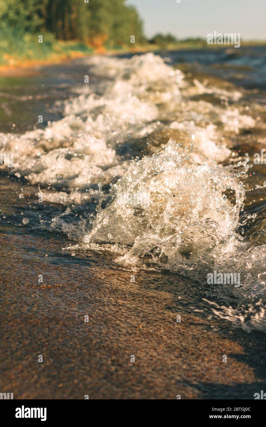 On sandy shore background wavy hi-res stock photography and images - Alamy