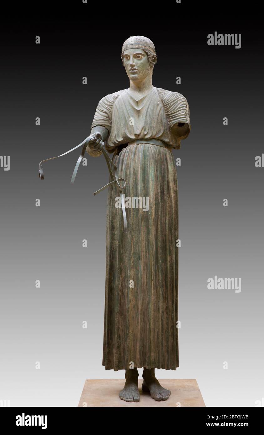 The 470 BCE ancient bronze sculpture The Charioteer of Delphi, also ...