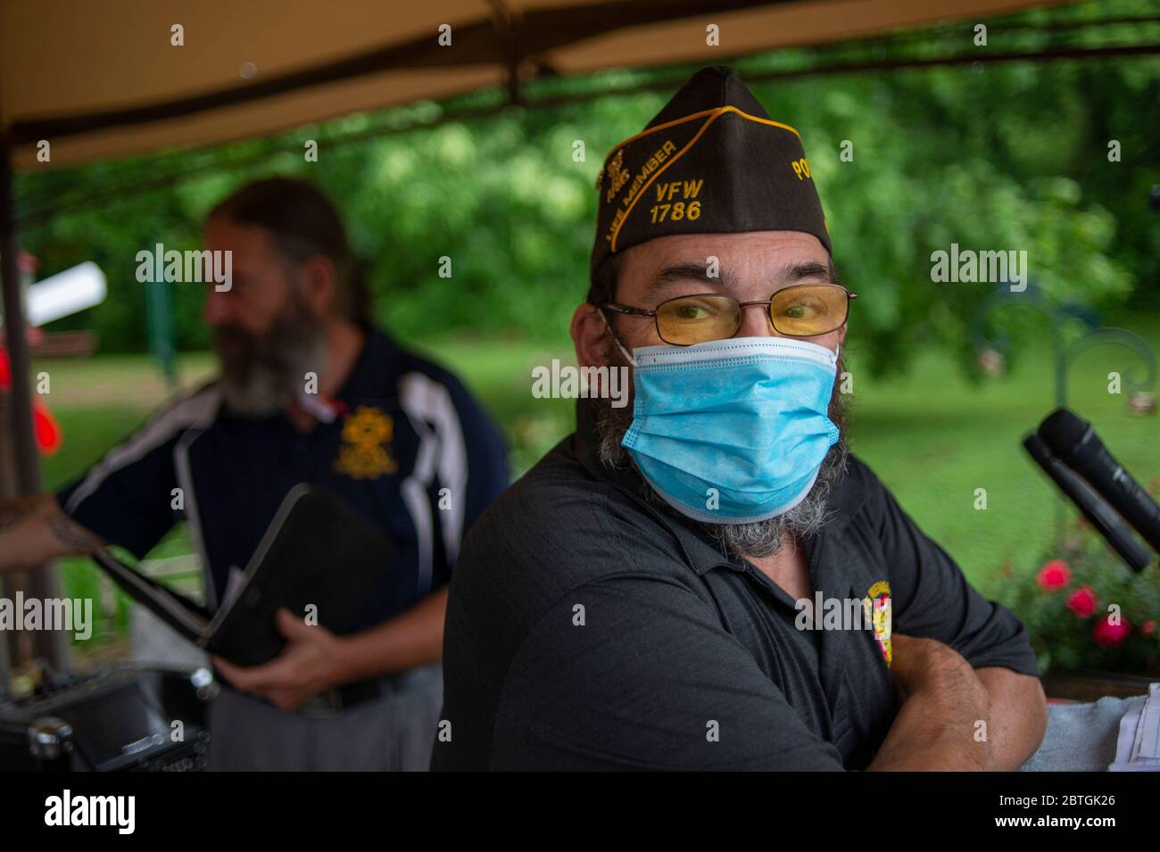 Manhattan, Kansas, USA. 25th May, 2020. CHRIS DUNHAM talks to friends ...