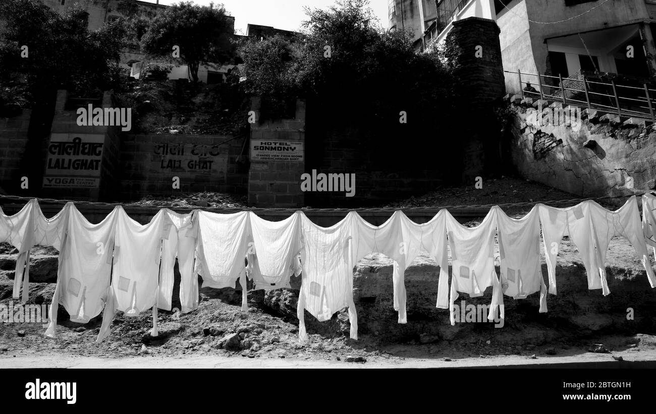 Clothes line hanging in Black and White Stock Photos & Images - Alamy