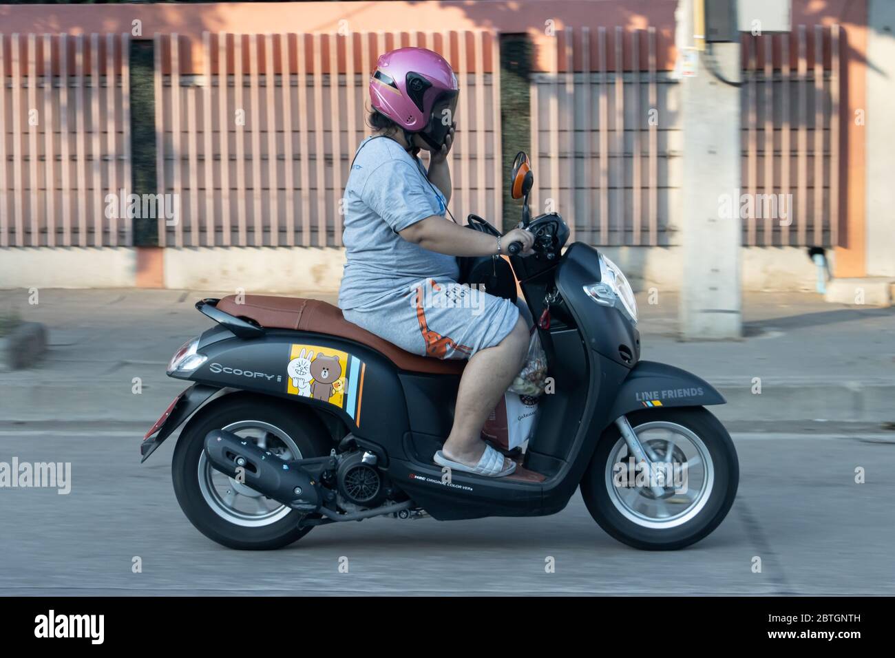 Female motor scooter rider hi-res stock photography and images - Alamy