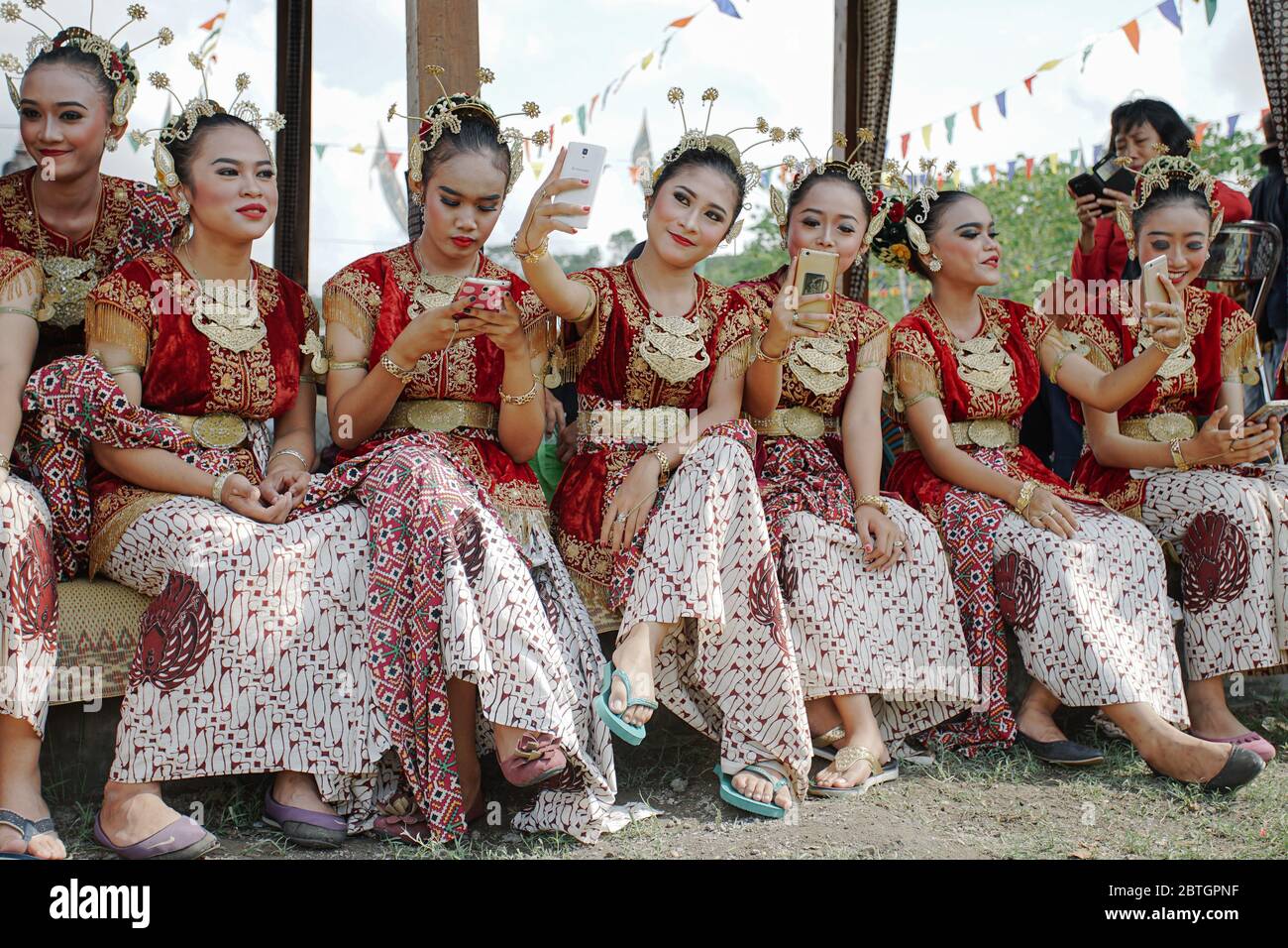 Javanese women dancers play and take a self portrait with their ...