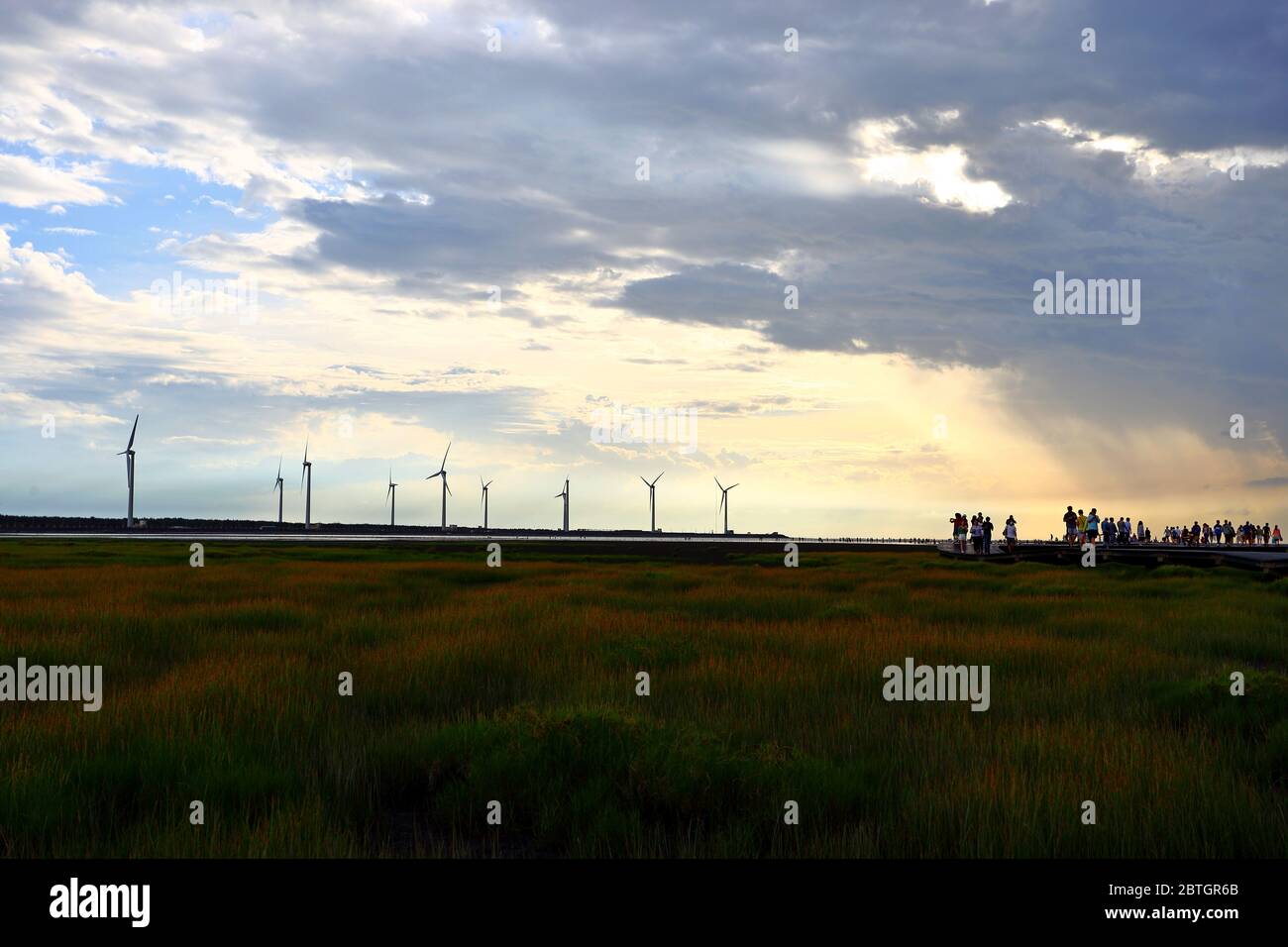 Gaomei wetlands during sunset with wind turbine background in Taiwan ...