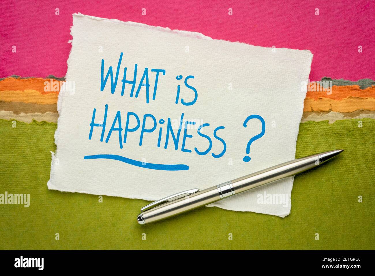 What is happiness? Handwriting on a small sheet of white Khadi rag ...