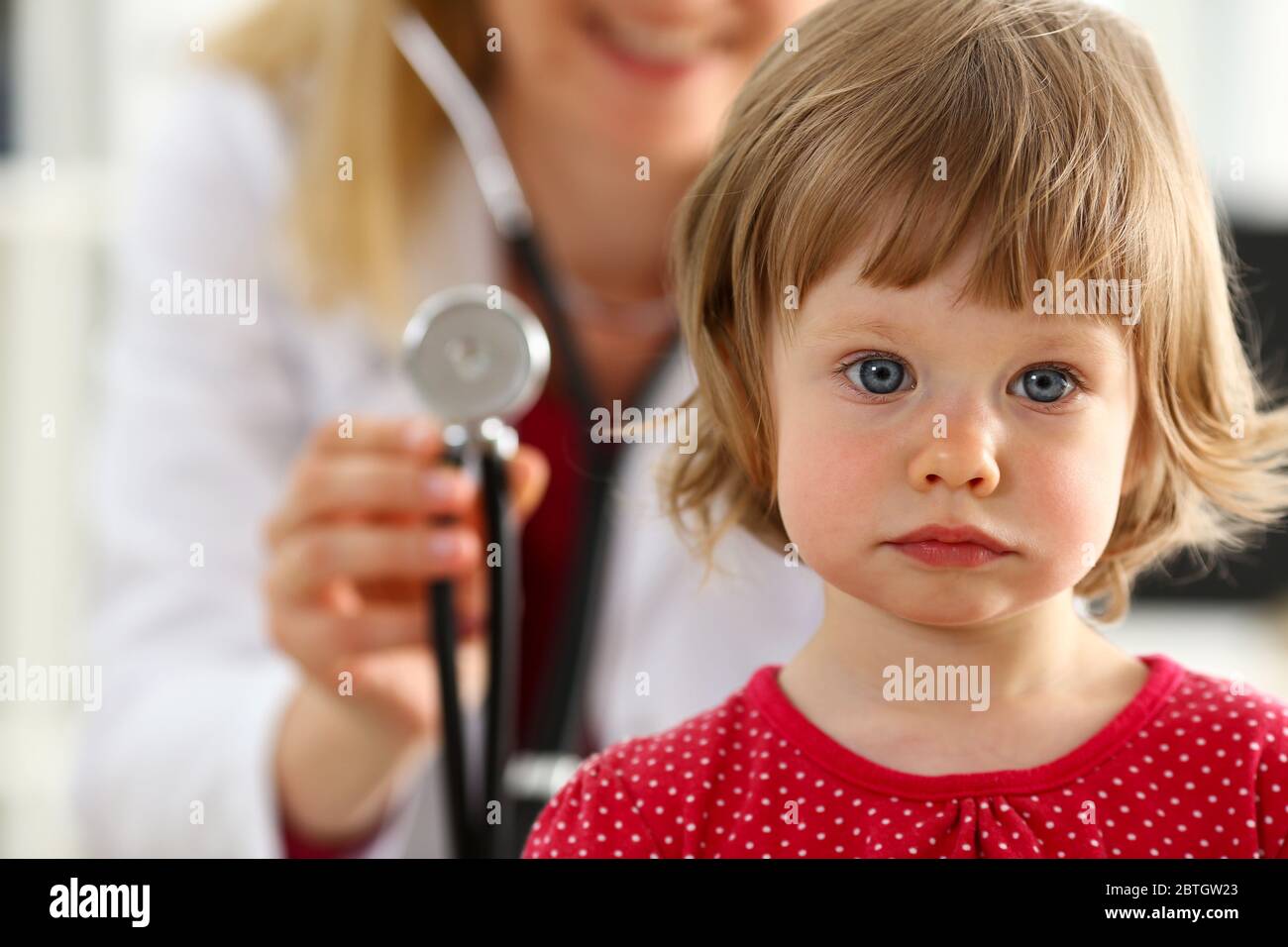 Little child with stethoscope at doctor reception Stock Photo - Alamy