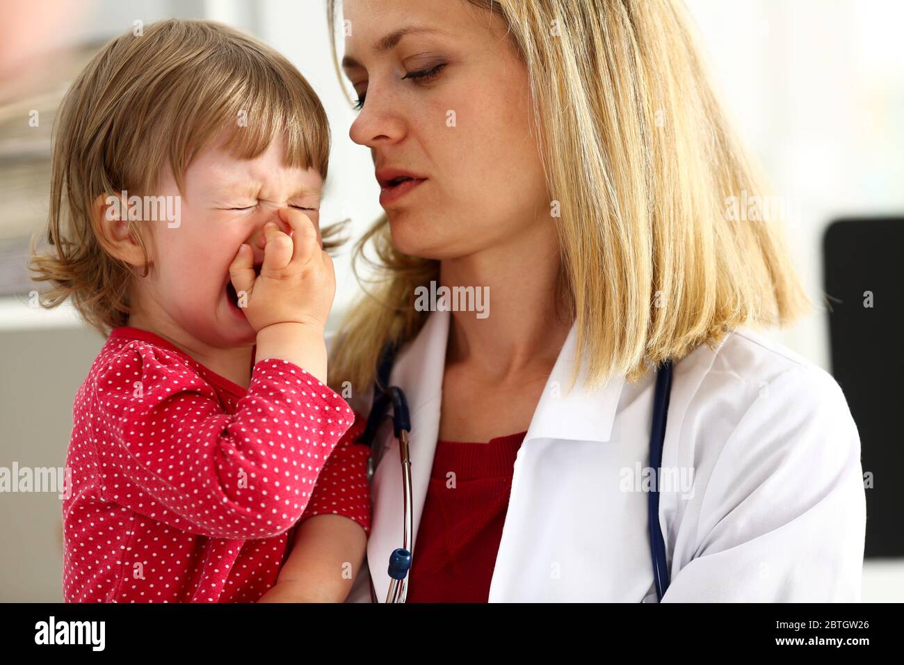 Little scared child at doctor reception Stock Photo - Alamy