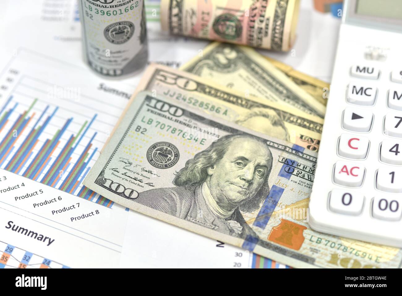 Exchange rate concept. Dollars bills and Diagram of stock market prices rates. One us dollar bills rolled hundred us dollar bills. Ruler on the chart Stock Photo Alamy