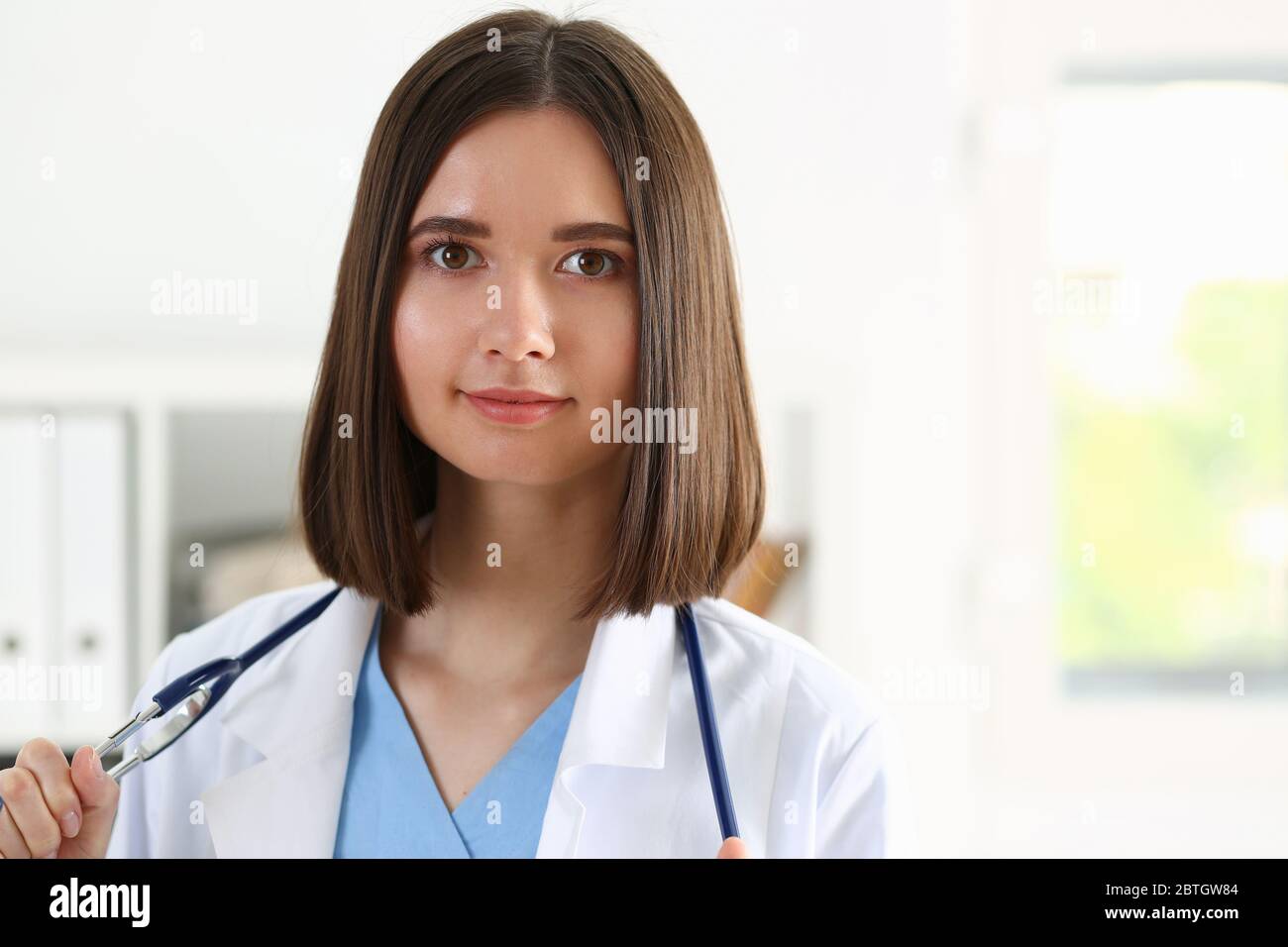 Beautiful smiling female doctor stand in office portrait Stock Photo ...