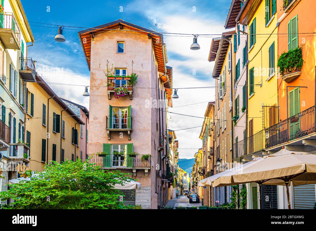 Traditional colorful building with balconies, shutter windows and ...