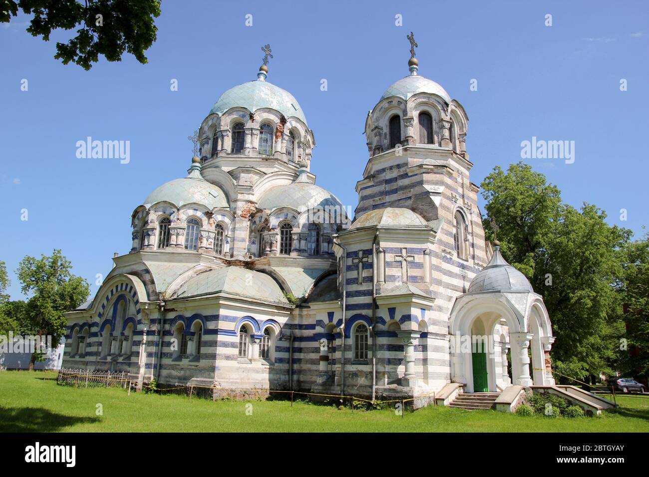 The historic, white and blue striped stucco church of the Holy Trinity ...