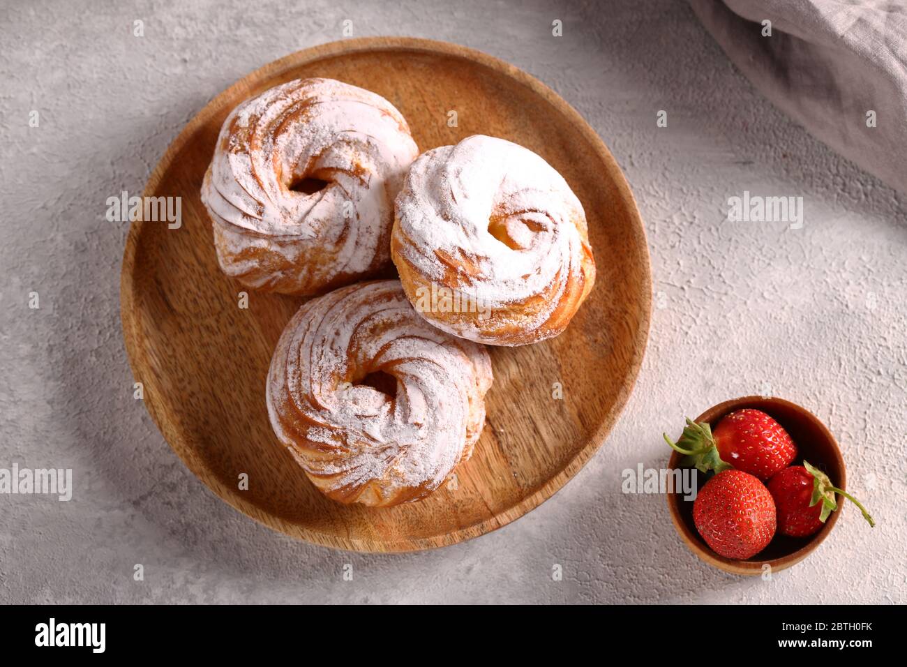 donuts in icing sugar for treats and desserts Stock Photo - Alamy