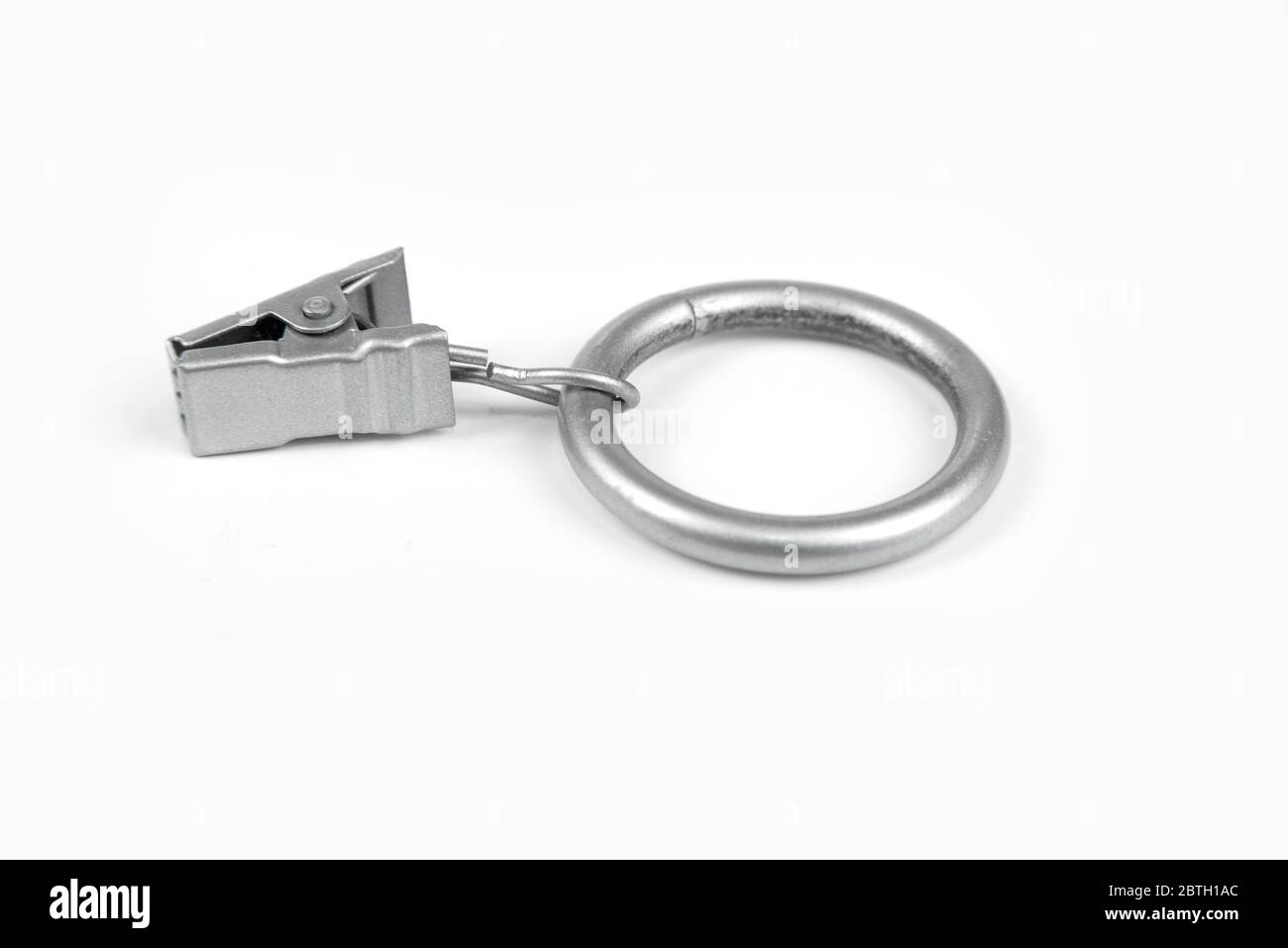 Metal curtain ring with clipper in a white background Stock Photo - Alamy