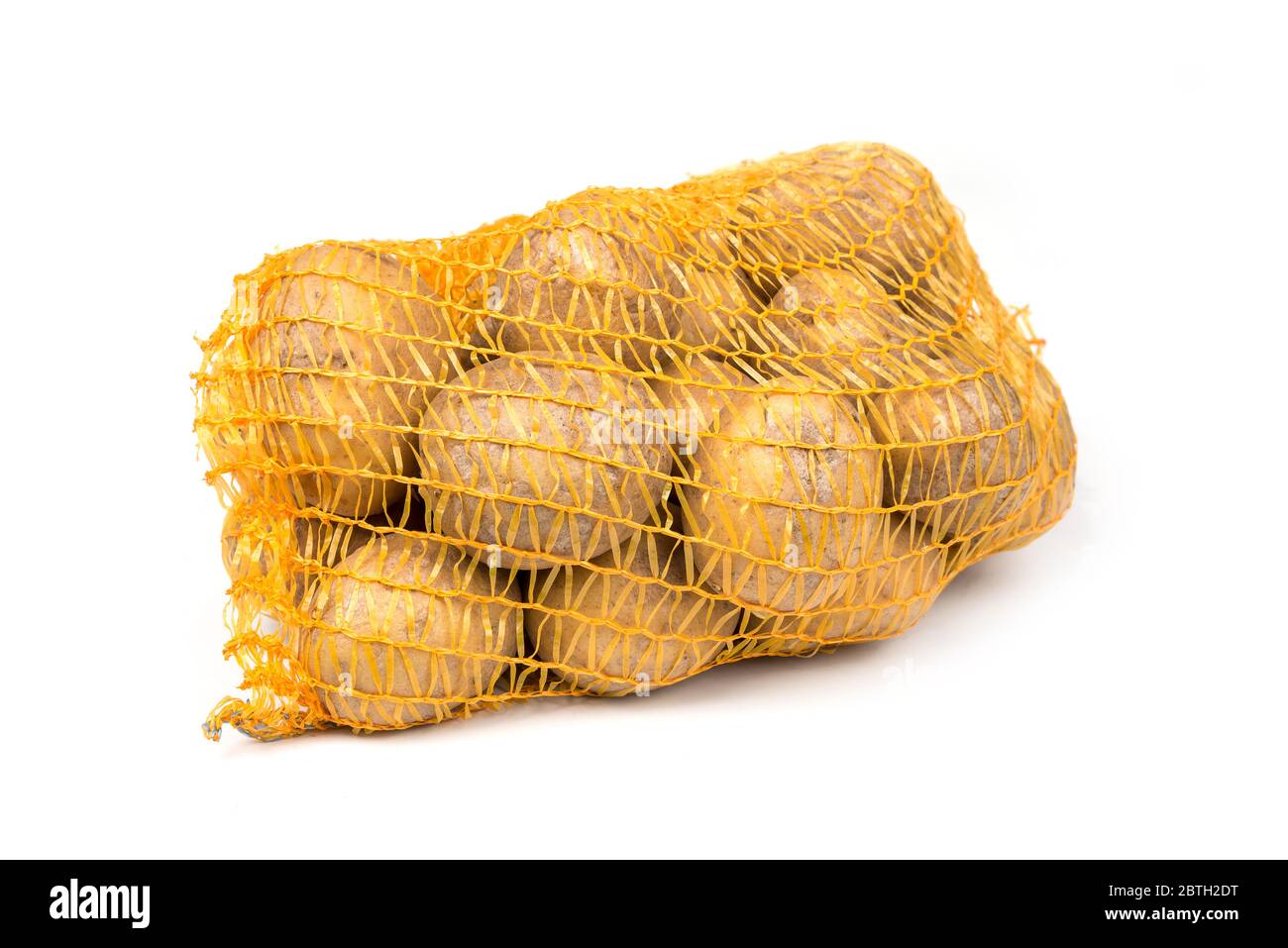 Potato in the mesh net bag on a white Stock Photo - Alamy