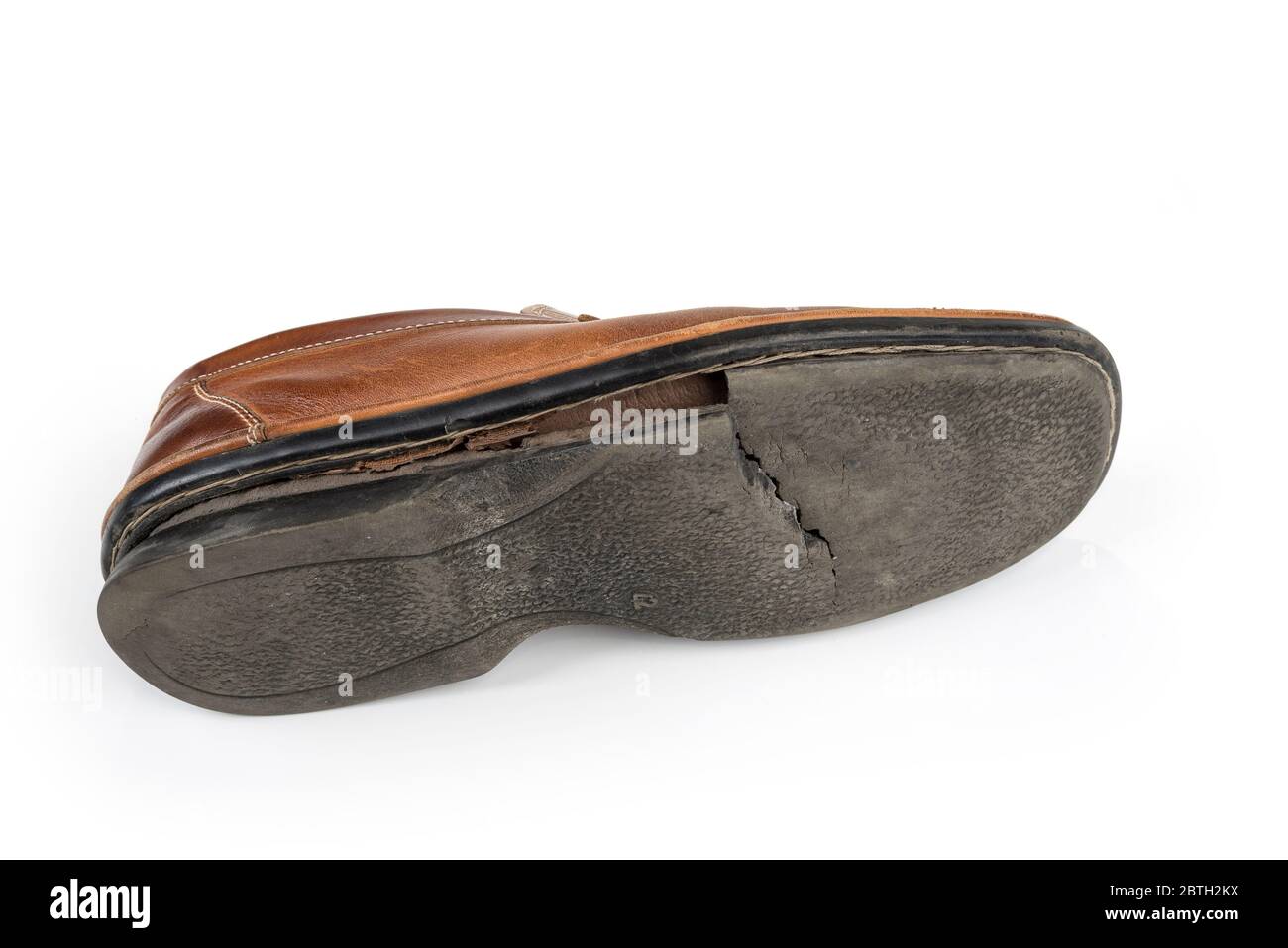 Torn leather shoes on a white background Stock Photo - Alamy