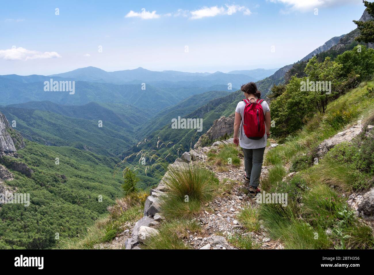 Female hiker on mountain pathway, Ligurian Alps, Italy Stock Photo - Alamy