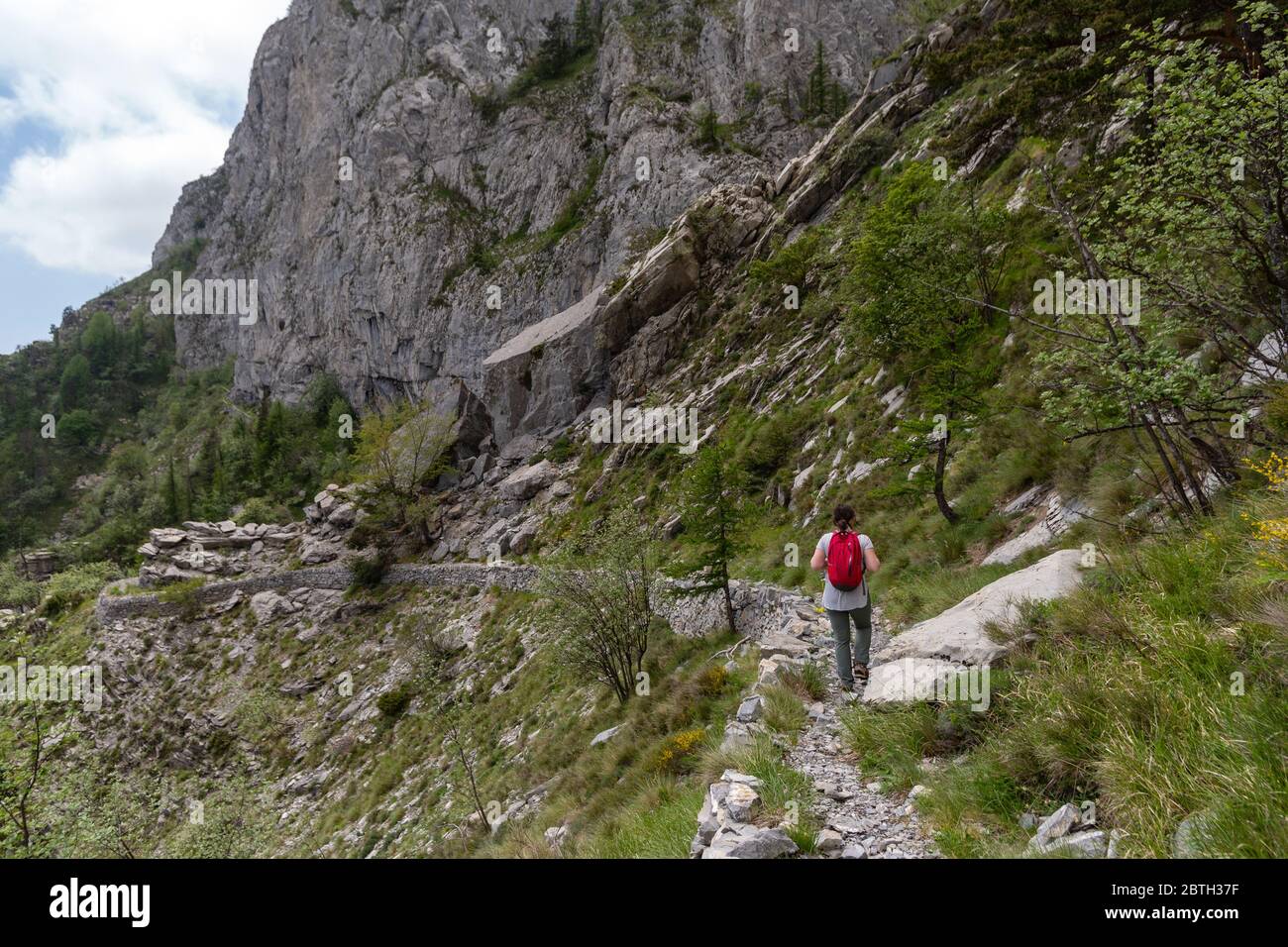 Female hiker on mountain pathway, Ligurian Alps, Italy Stock Photo - Alamy