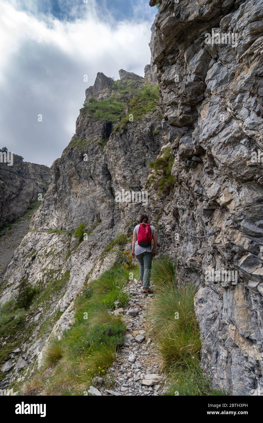 Female hiker on mountain pathway, Ligurian Alps, Italy Stock Photo - Alamy