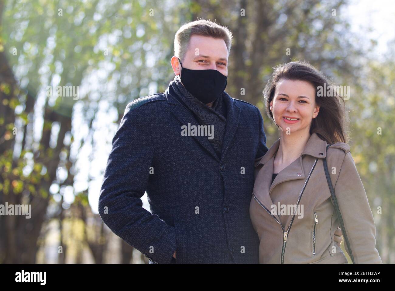 Couple walking in park protective hi-res stock photography and images ...