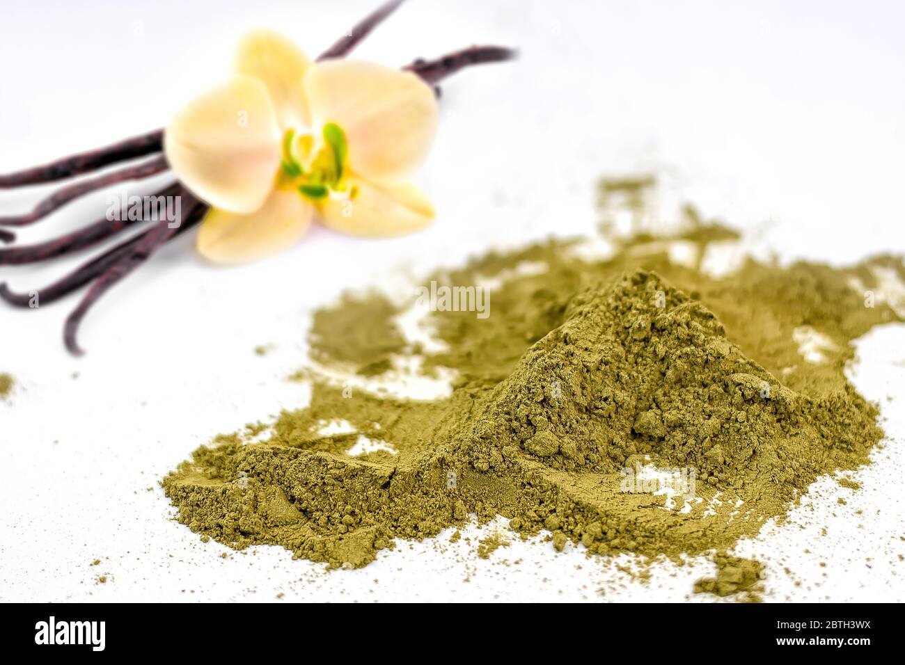 Dry Matcha Vanilla tea powder with orchid flower and vanilla sticks on ...
