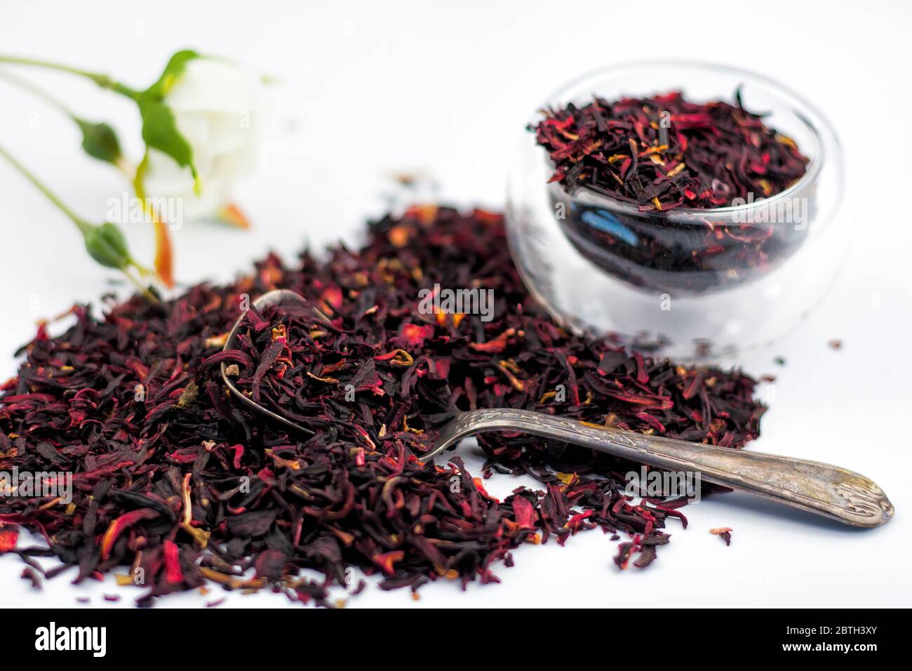 Dry Egyptian Red tea herbs with flowers on white background. Selective ...