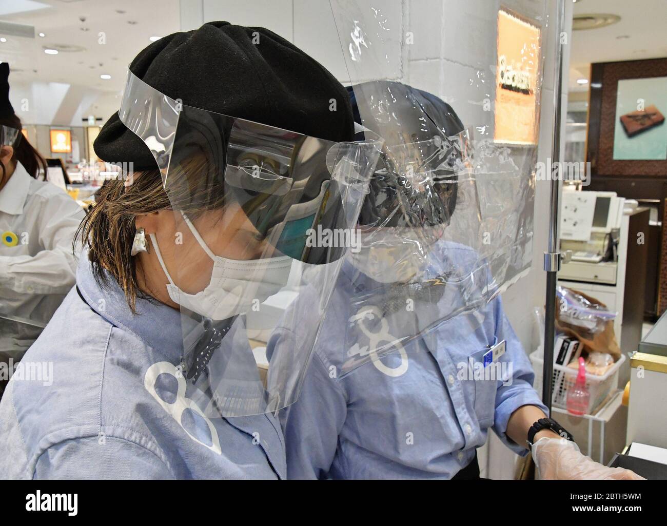 Employees wearing face shields and face masks are seen at the Matsuya ...